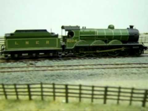 LNER B4 steam locomotive and mixed teak coaches pass through Bardney ...