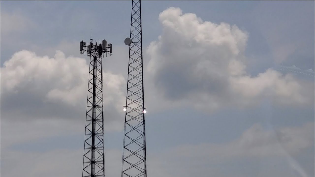 A tower with two tiers of TWR L-865 white xenon strobes and a smaller cell tower with an LED ...