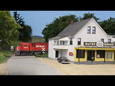 CP Rail Train 937 passes Joe's Super Market at Richford, VT on a warm summer afternoon in 1980. 