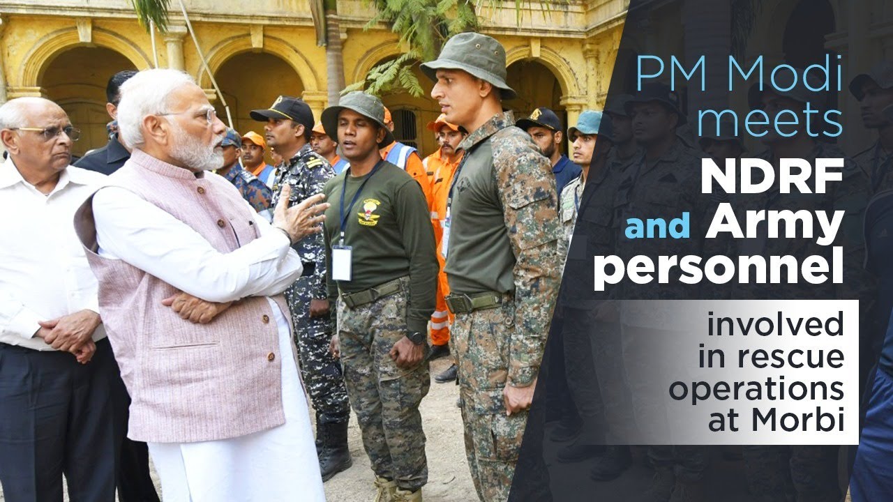 PM Modi meets NDRF and Army personnel involved in rescue operations at ...