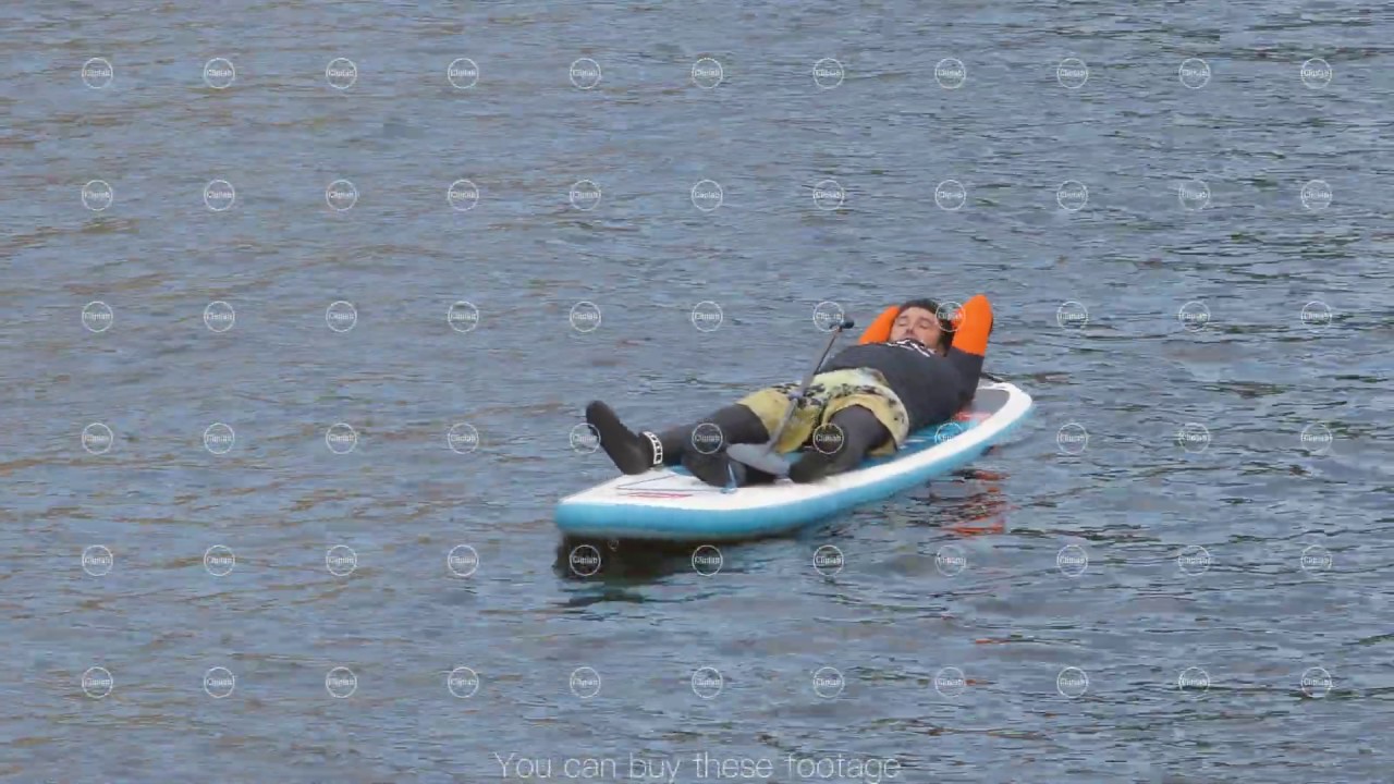 ST PETERSBURG, RUSSIA: Man sleep on the SUP board, then wake up and ...