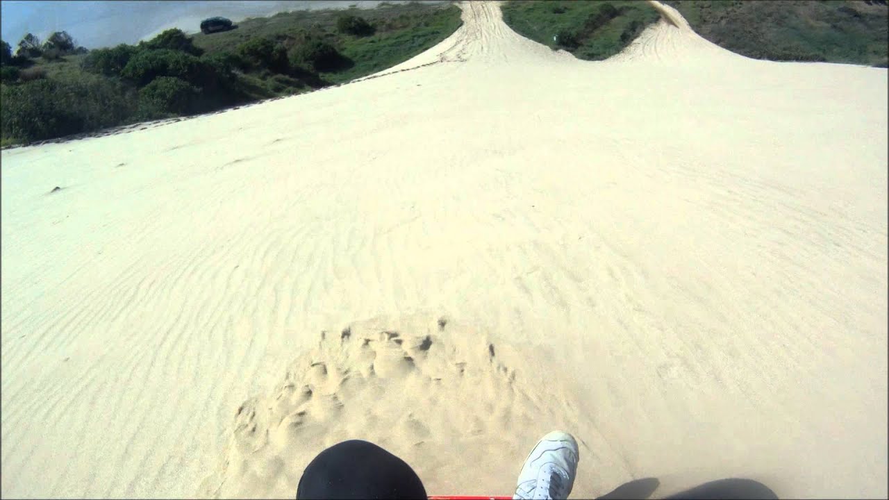 Sand Tobogganing before a surf... - YouTube