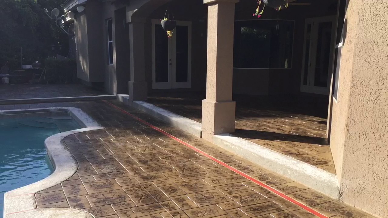Ashlar slate stamped concrete pool deck Orlando - YouTube