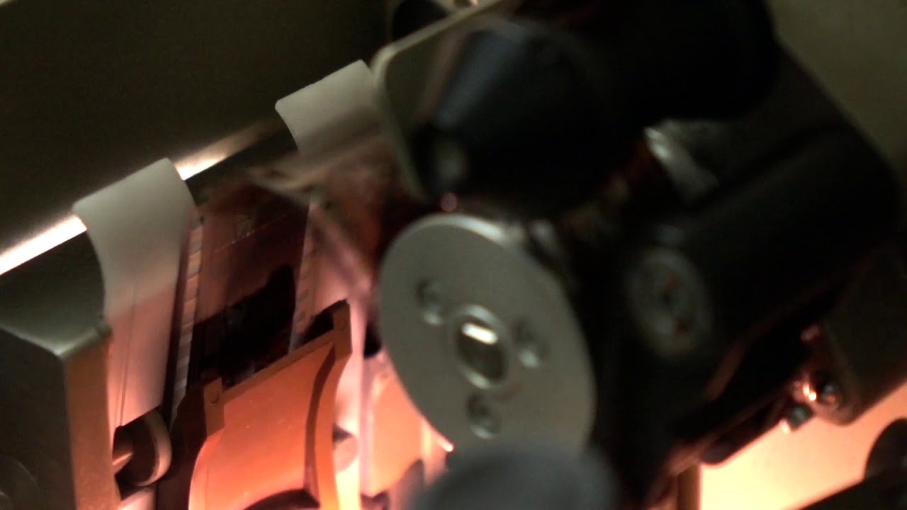 professional cinema 35 mm film projector in action slow motion video ...