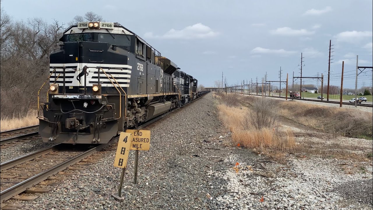 NS 2768 leads some empty intermodal cars through Portage/Ogden IN - YouTube
