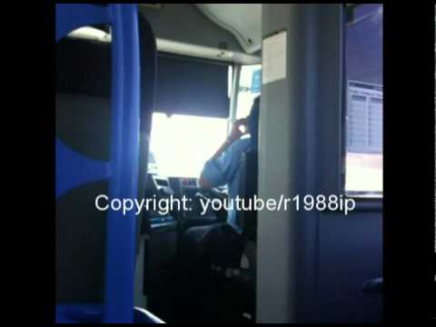 Translink bus driver talking on mobile phone while driving bus - YouTube