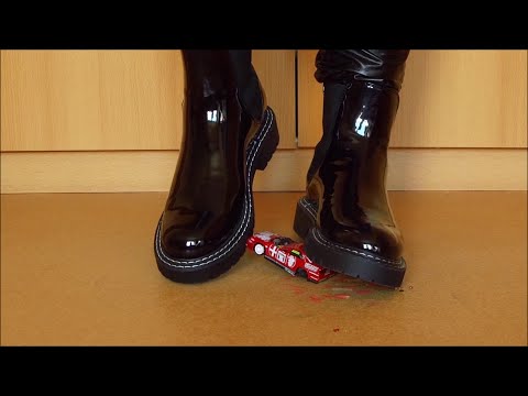 Jana crush a model car with her Graceland chelsea black patent ankle boots trailer