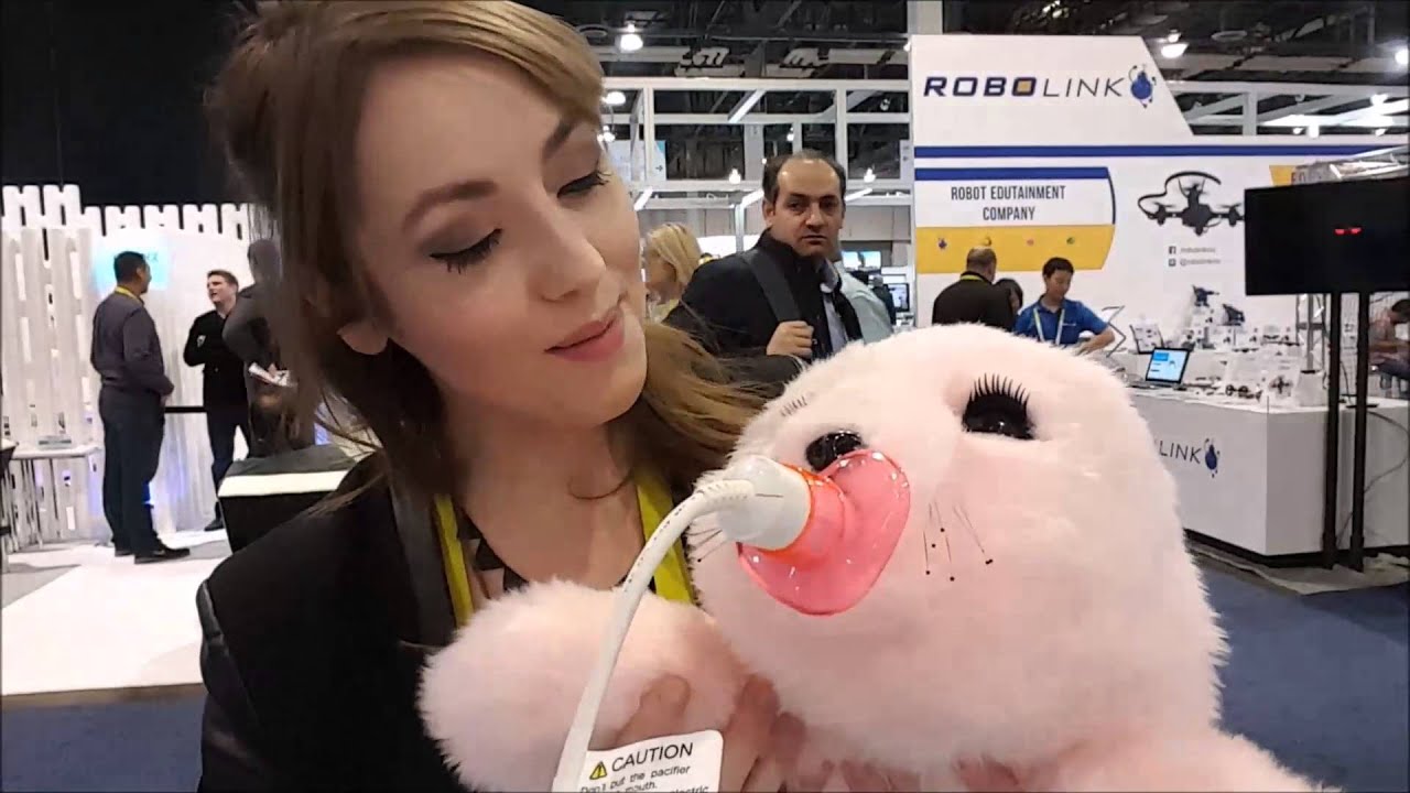 Cuddling up to Paro, the seal-shaped therapy robot at #CES2016 - YouTube