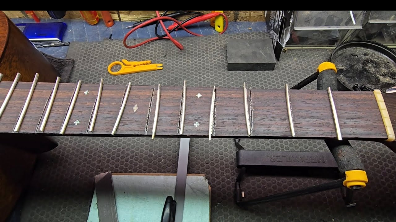 Guitar repair. installing new frets on a Martin d15m . some friendly ...