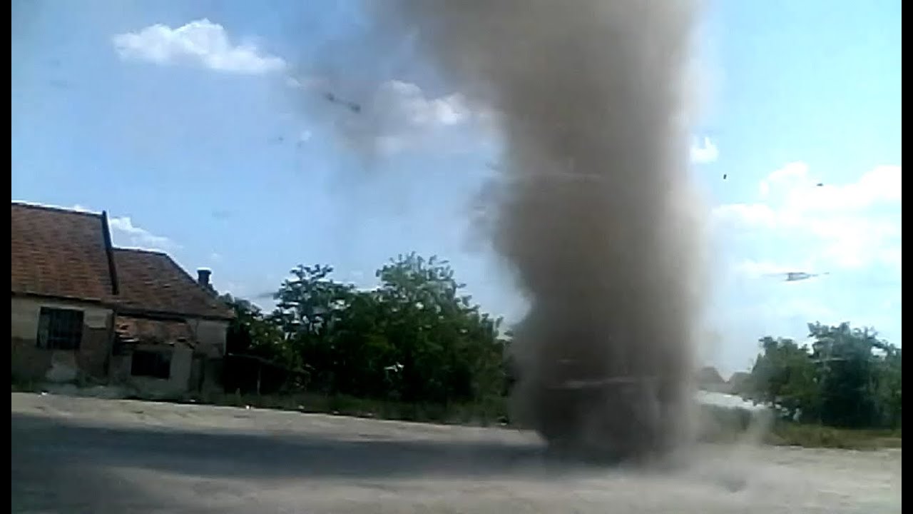Mini tornado (dust devil) hits truck in parking lot - YouTube
