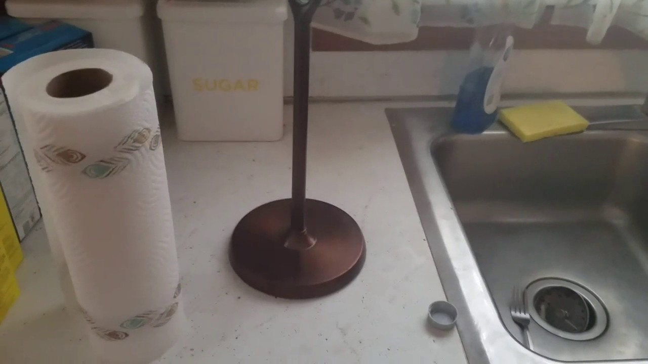 How to put a paper towel roll into a paper towel holder - YouTube