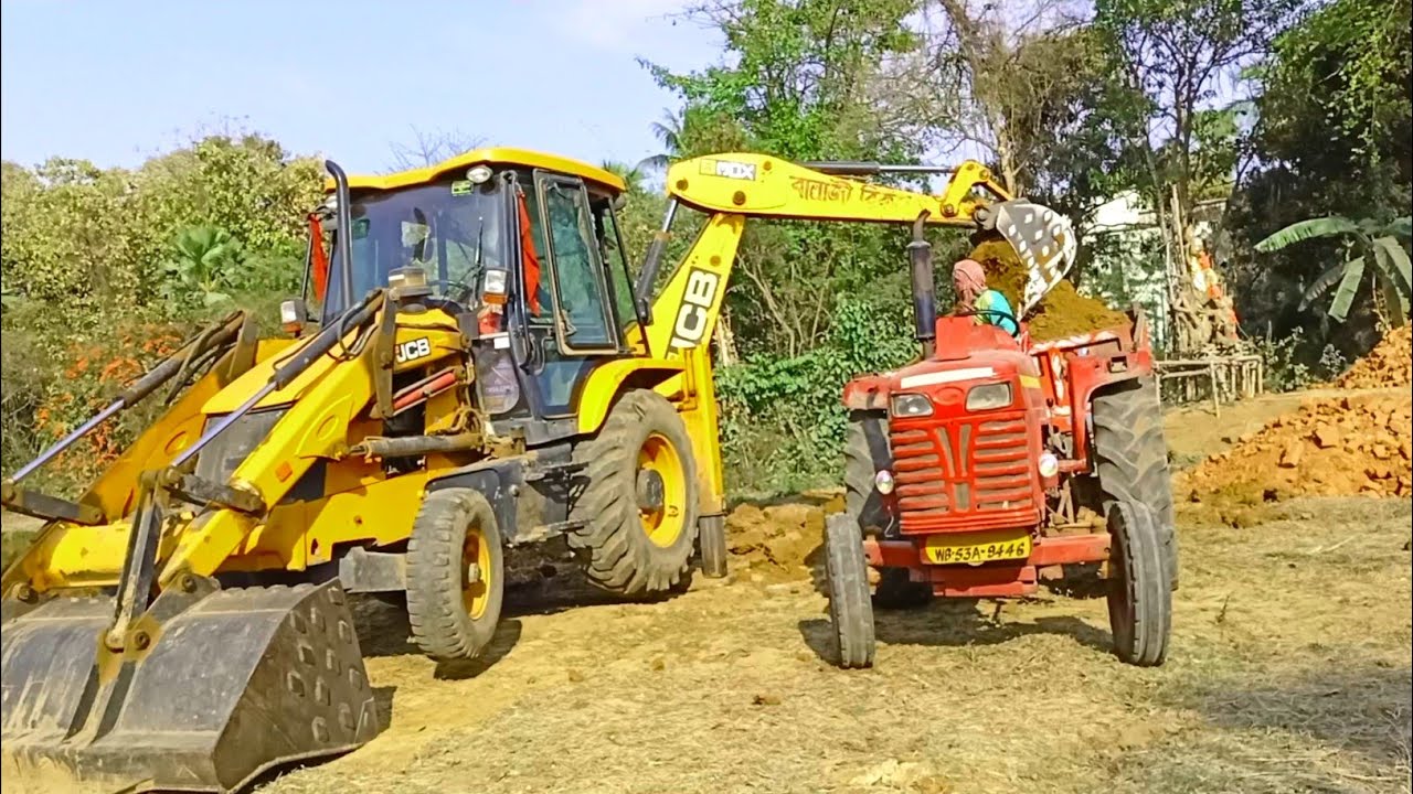Jcb 3dx Backhoe Loader Machine Loading Red Mud In Mahindra 295 DI ...