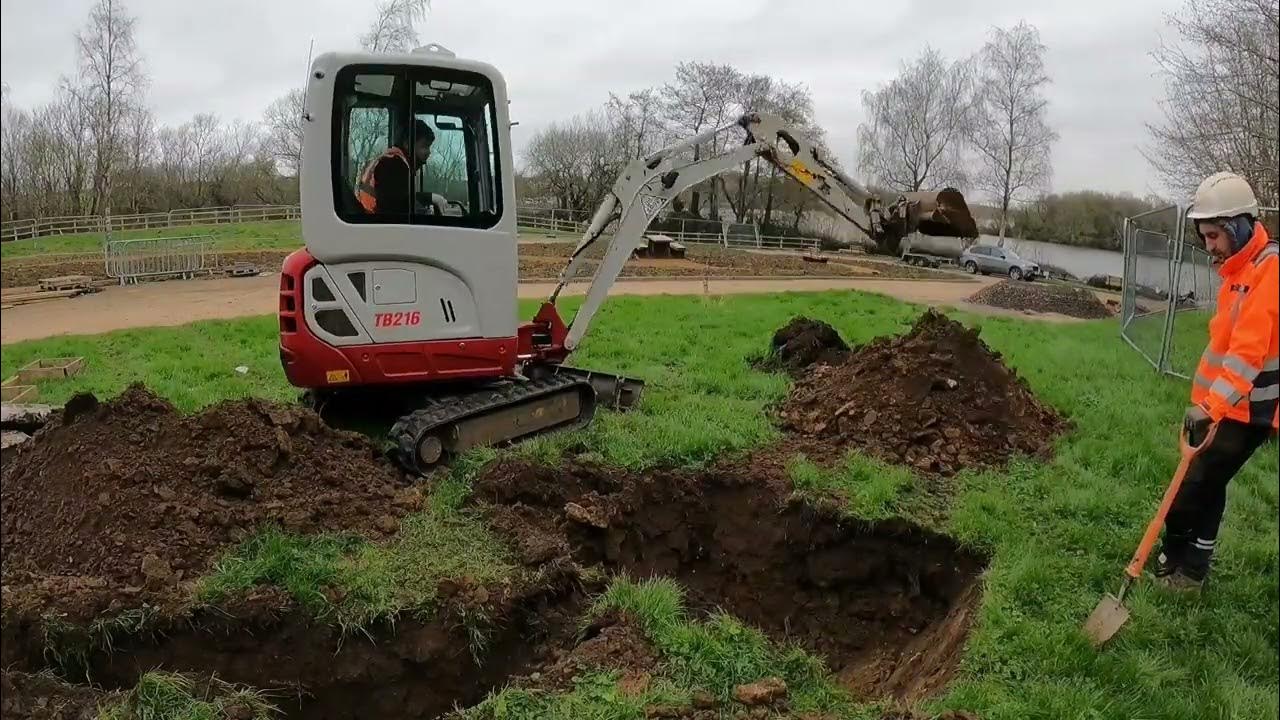Digging a soakaway & Finding Rock with our Takeuchi TB216 excavator - YouTube