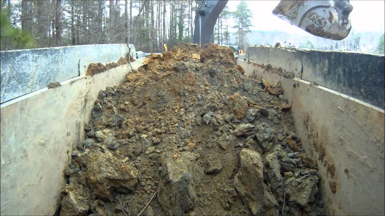Dump truck hauling and Dumping Dirt - YouTube