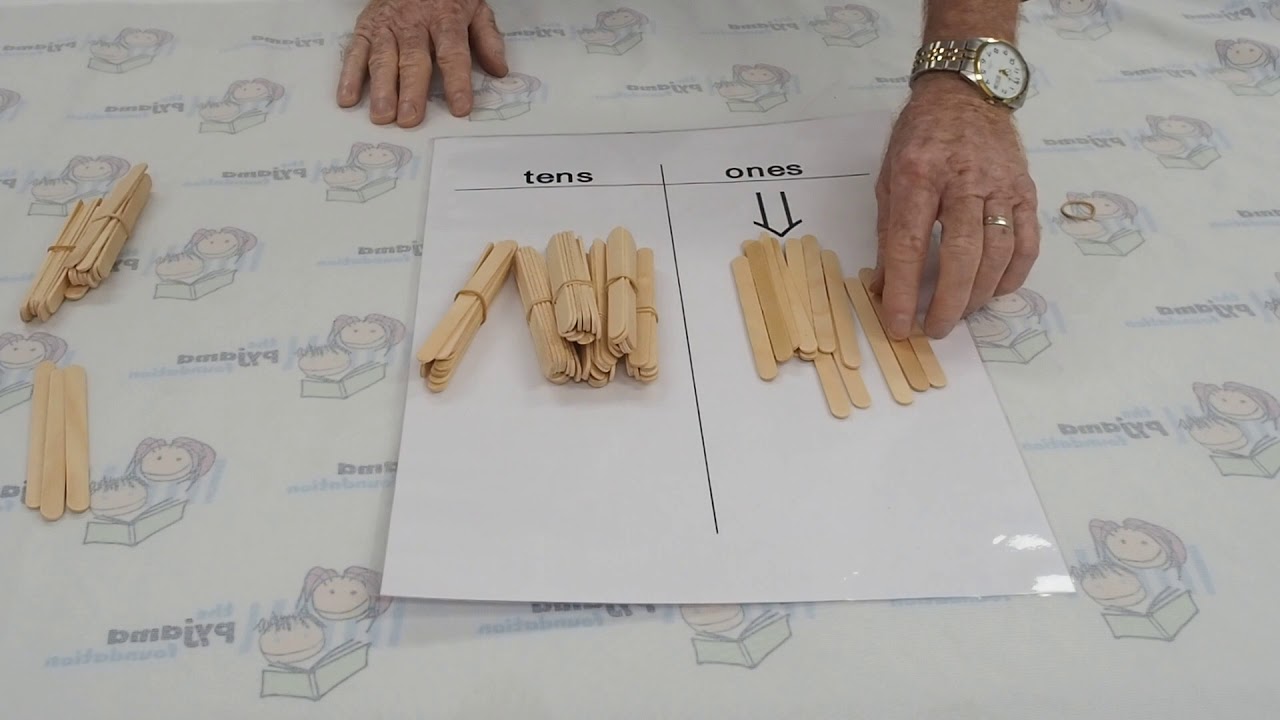 Subtracting 2 digit numbers with the place value chart and paddle pop ...
