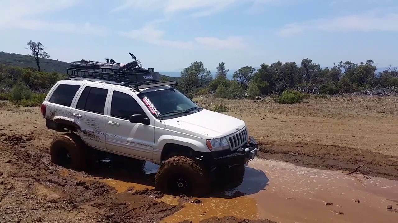 Grand cherokee WJ 4 link on 37" tires - YouTube