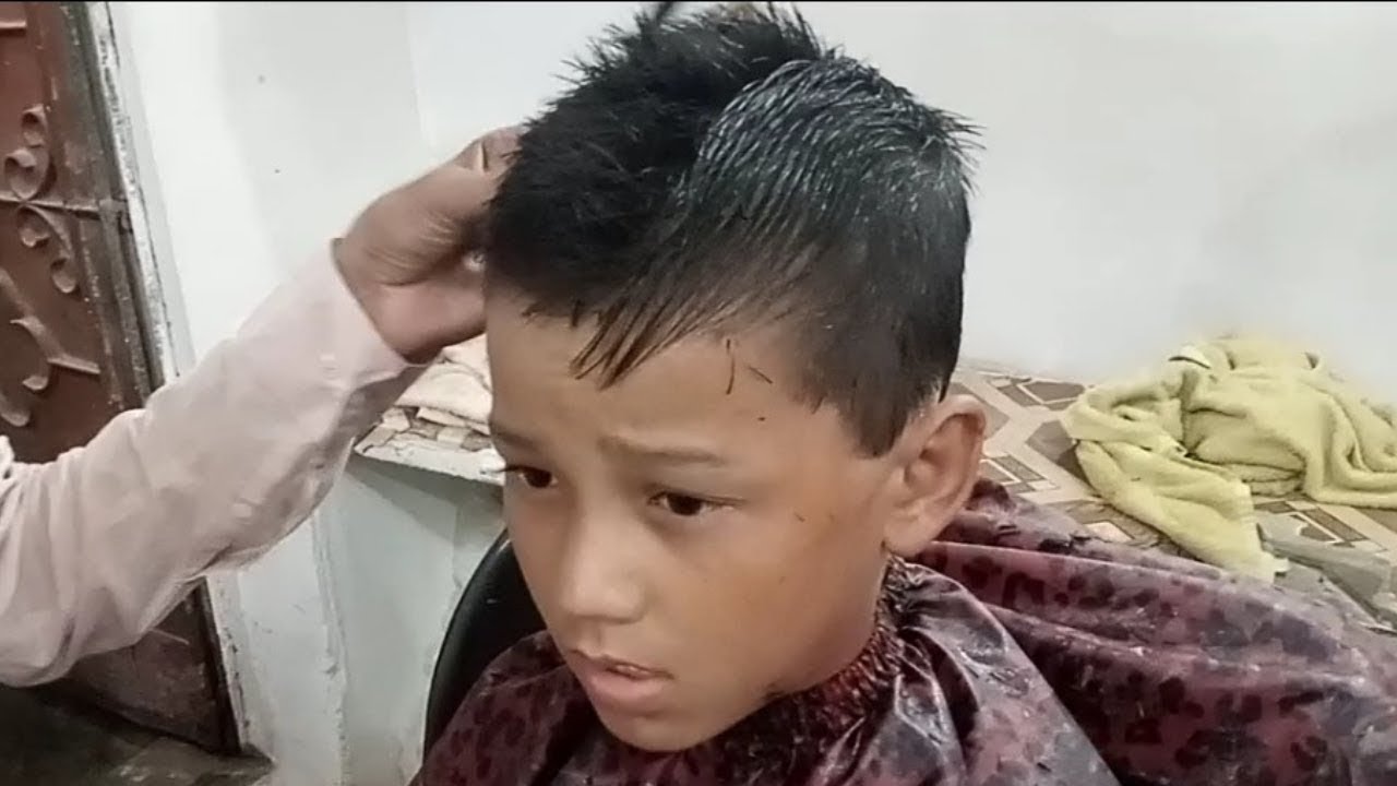 A Boy Getting His Summer Short Buzzcut With Scissors At Barbershop By ...