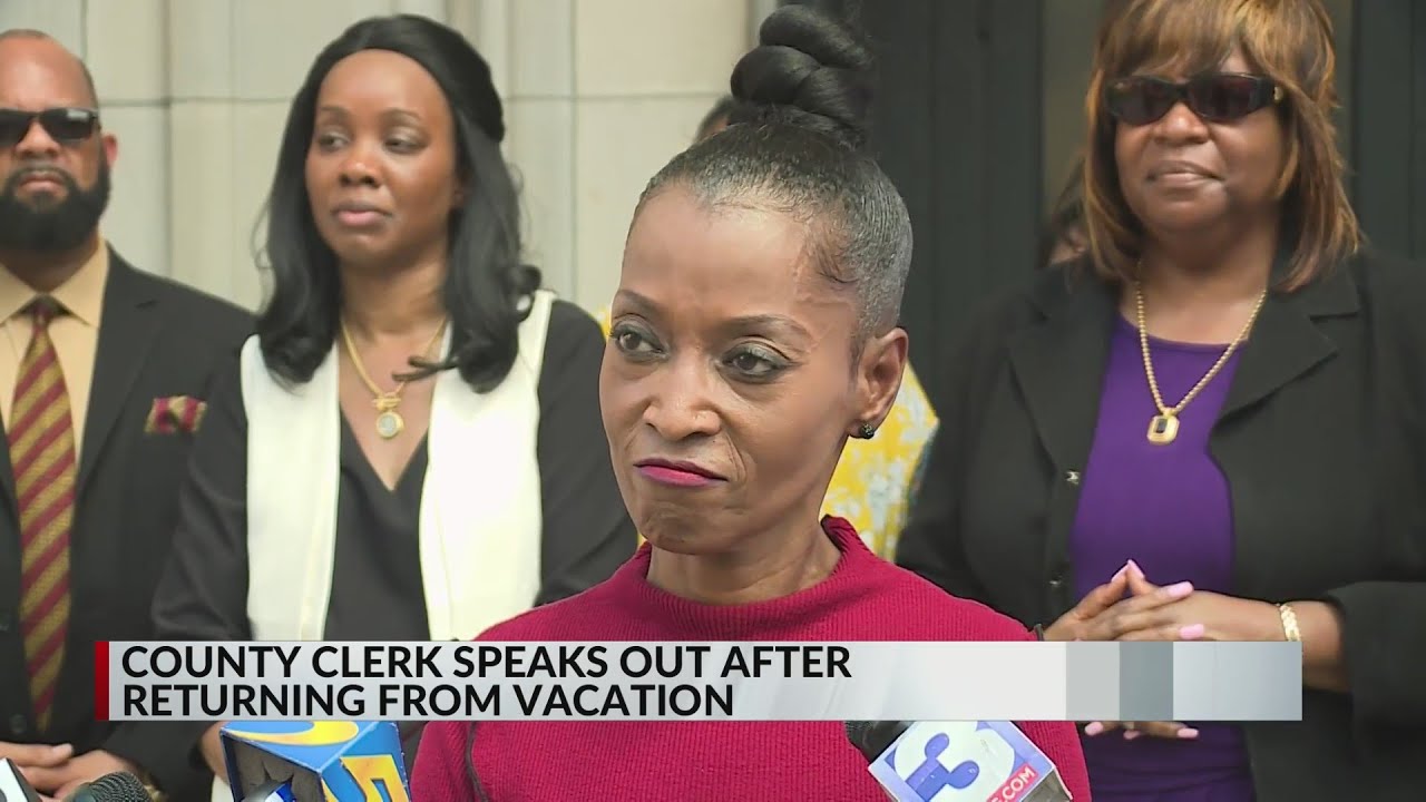 Wanda Halbert defends Jamaica trip as clerk's office reopens - YouTube