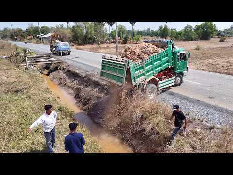 Starting a new project with a Mitsubishi Mini Bulldozer pushing soil into a ditch