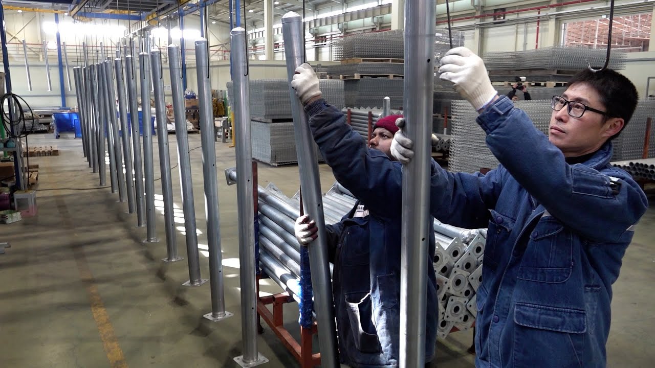 Mass Production Process of Making Iron Mesh Fences. Fence Factory in ...