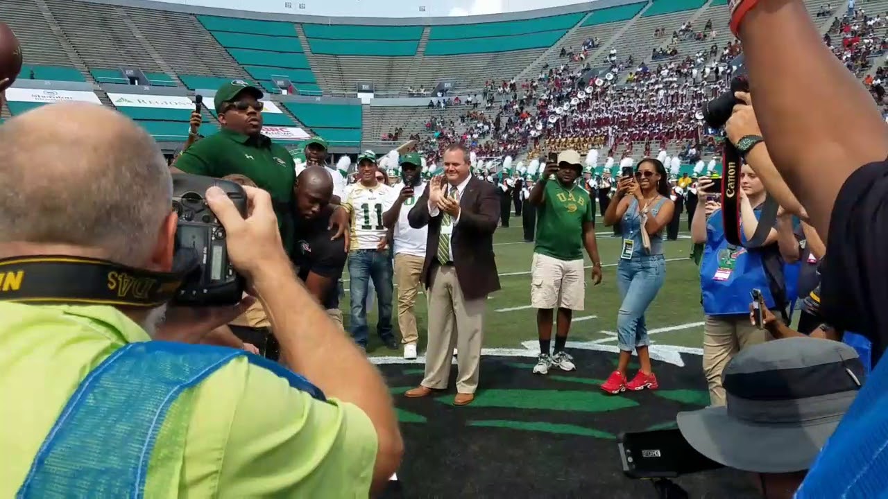 Paralyzed Tim Alexander presents UAB game ball - YouTube