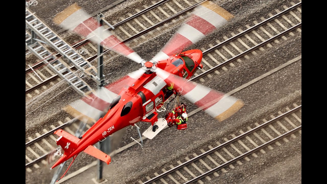 Look down on rescue helicopter hoist training Rega Leonardo AW109 Da ...