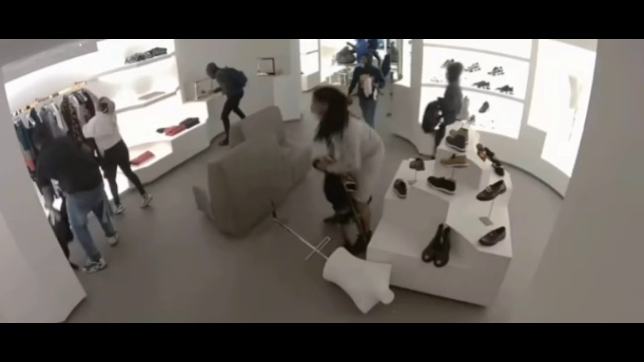 People taking things out of a luxury store - YouTube