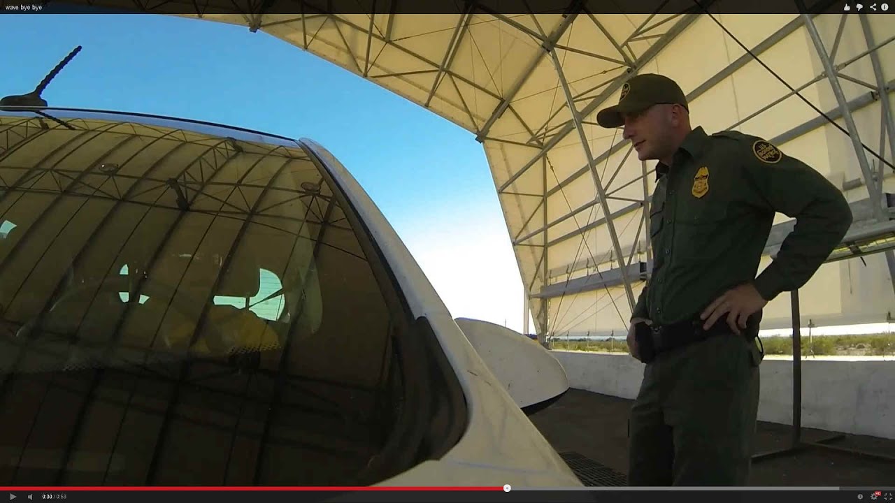 US Border Patrol Agent inspects couple leaving Ajo, Arizona north to ...