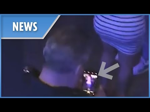 Cop appears to photograph a woman’s BUM at a Drake gig