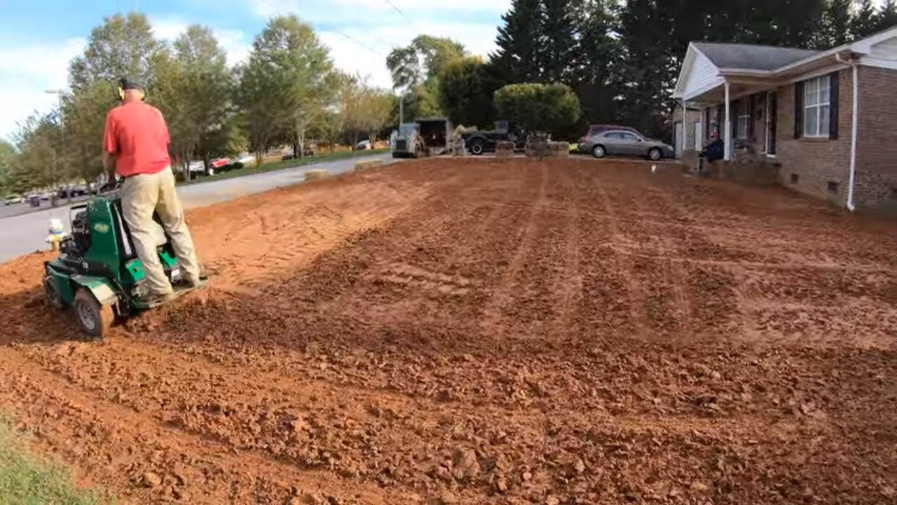 Regrading and seeding a residential yard - YouTube