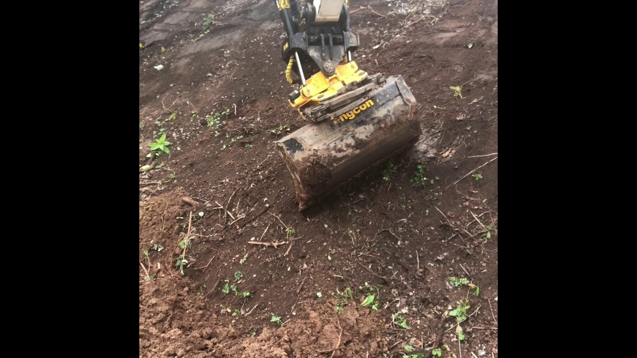 Ditch Grading with Engcon Tiltrotator - YouTube