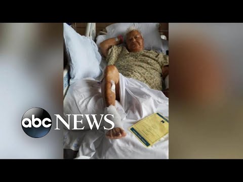 Woman in wheelchair falls down airport escalator