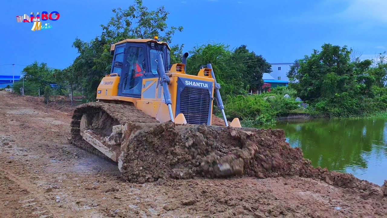 Great work! Dozer operator skilled pushing dirt to clear for building ...