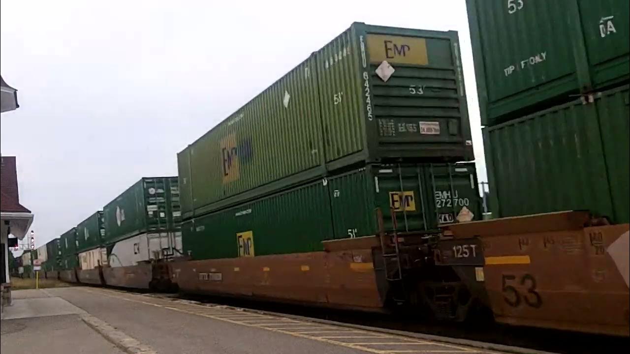 CN 148 w/ CN Engines 2344 & 2256 lead this long 546 axle, EB Intermodal/Autorack train by ...