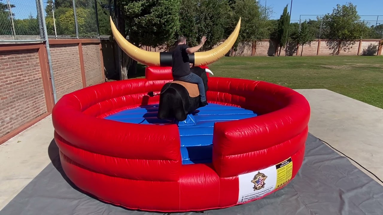 Mechanical Bull in Action, with round inflatable mattress / Toro ...