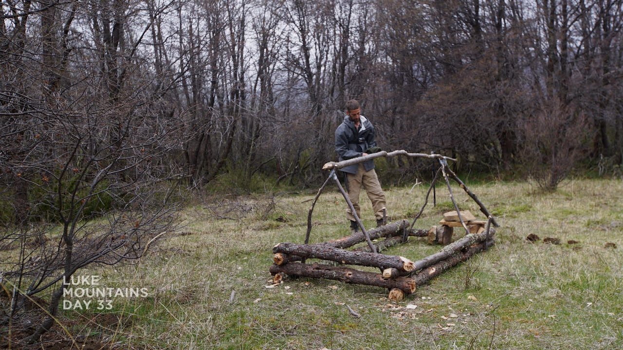 This Survivalist Is Building A Makeshift Cabin Complete With Fireplace ...