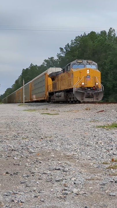 UP #5969 leads a Fast WB Auto train - YouTube