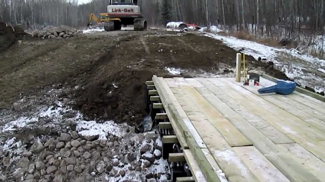 Rip rap work and finishing the bridge - YouTube