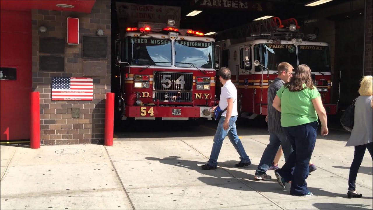 FDNY ENGINE 54 RESPONDING, WITH CAPTAIN GIVING A WAVE, ON 8TH AVE. IN ...