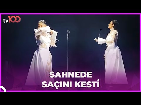 Melek Mosso'dan İranlı kadınlara destek... Sahnede saçını kesti