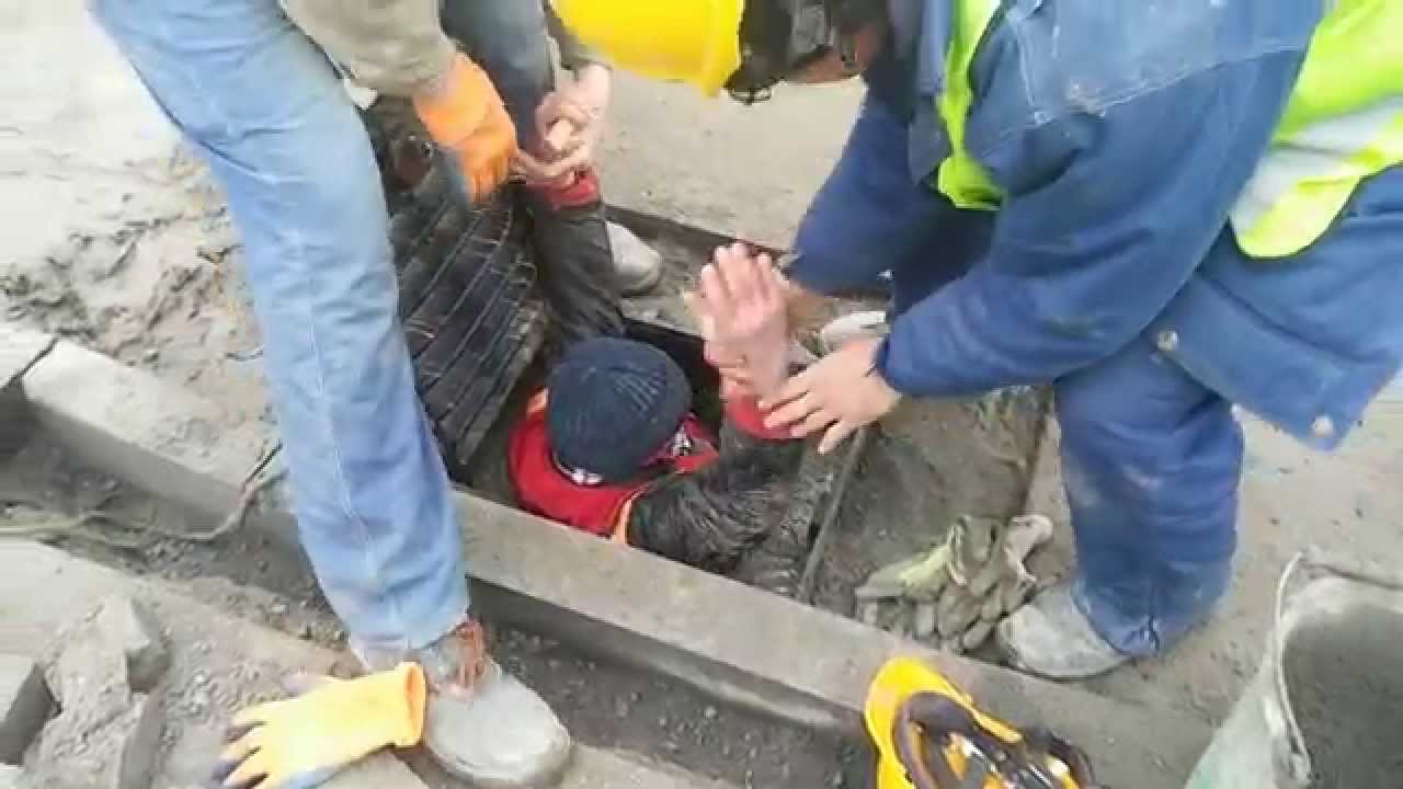 man stuck in a manhole - YouTube