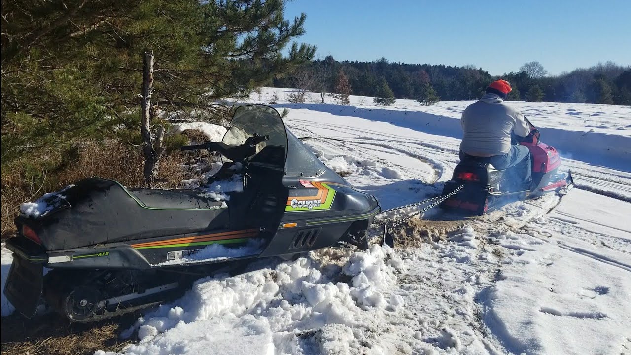 Towing snowmobiles and breaking them. - YouTube