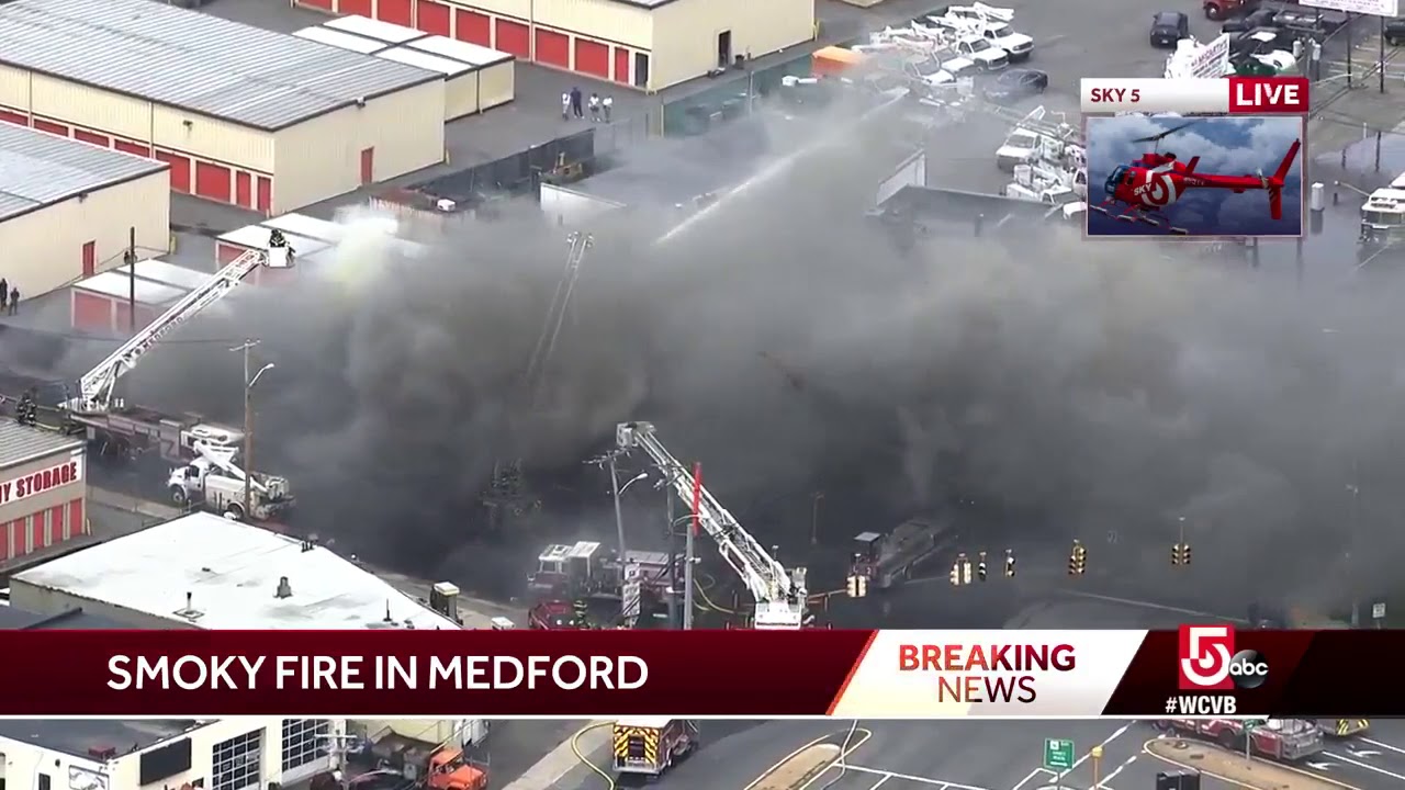 Firefighters battle smoky fire in Medford - YouTube