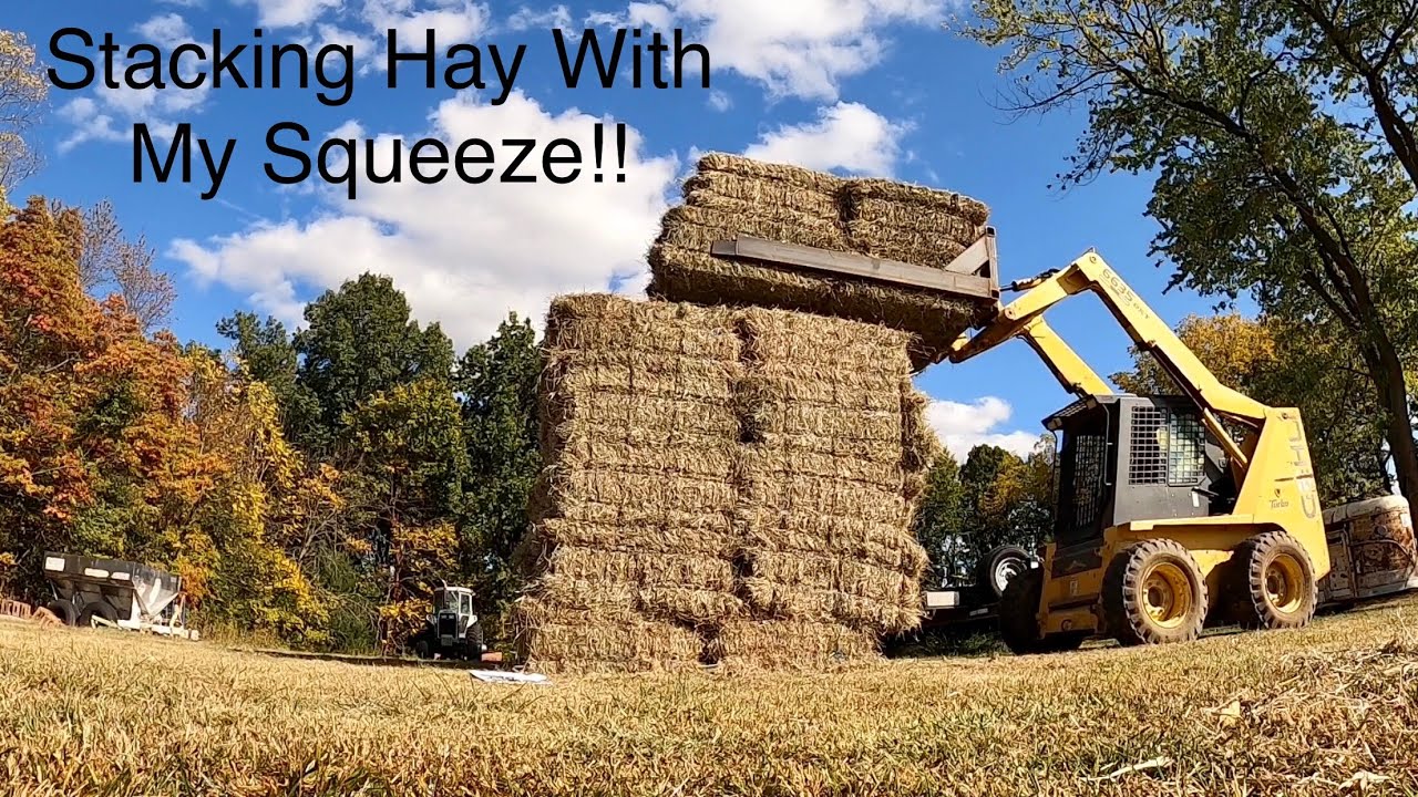 Using My Squeeze and New Holland Stacker to Handle Hay!!! - YouTube