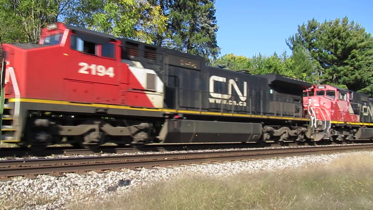 CN 2334, 2513, 2149 move an Eastbound freight train with BNSF, WC cars ...