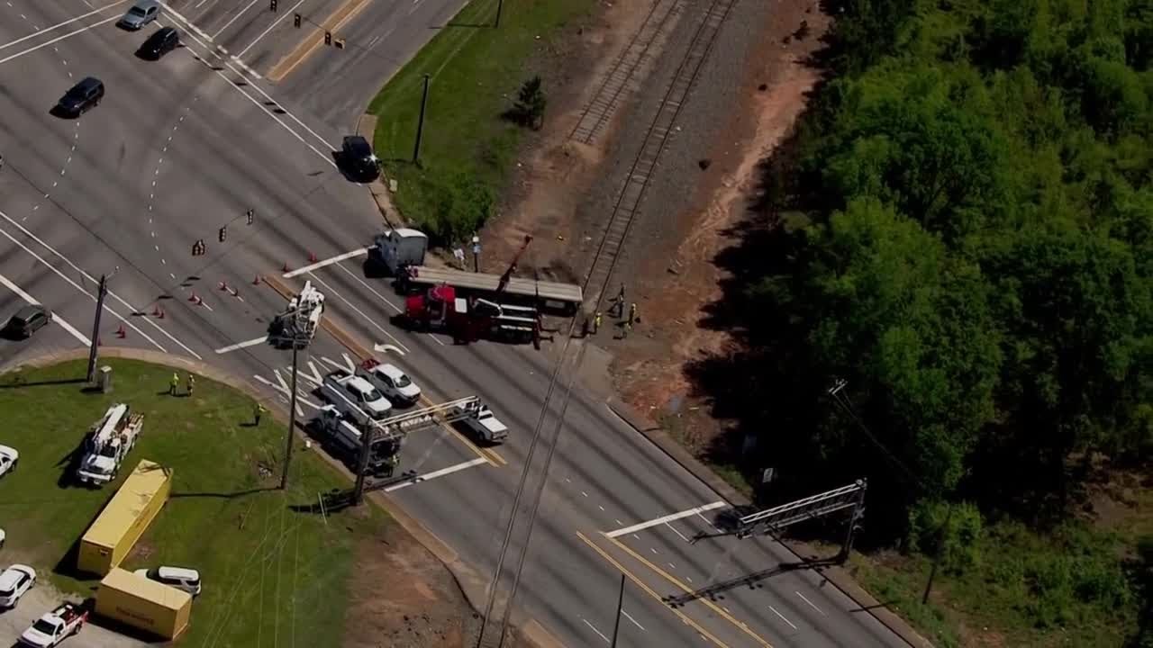 Train hits tractor-trailer on tracks at light on South Carolina highway ...