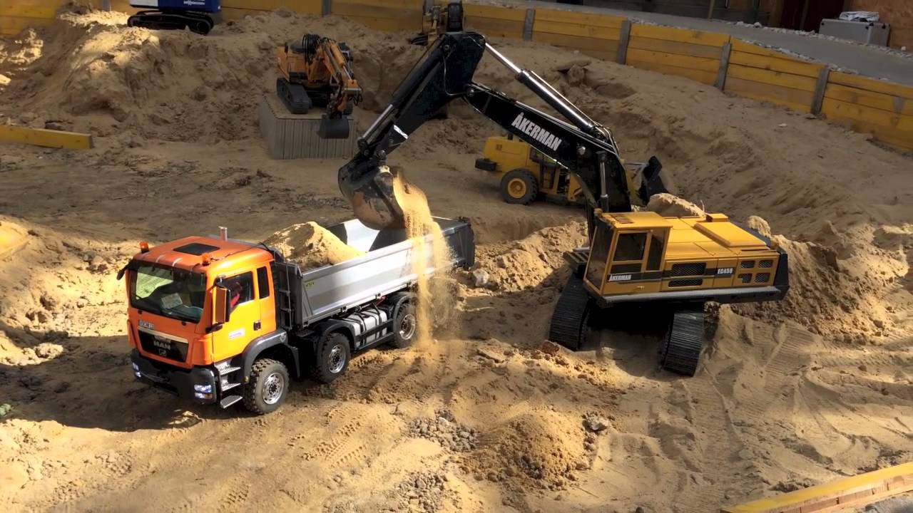 Akerman EC 450 loads Scaleart MAN TGA 8x8 - YouTube