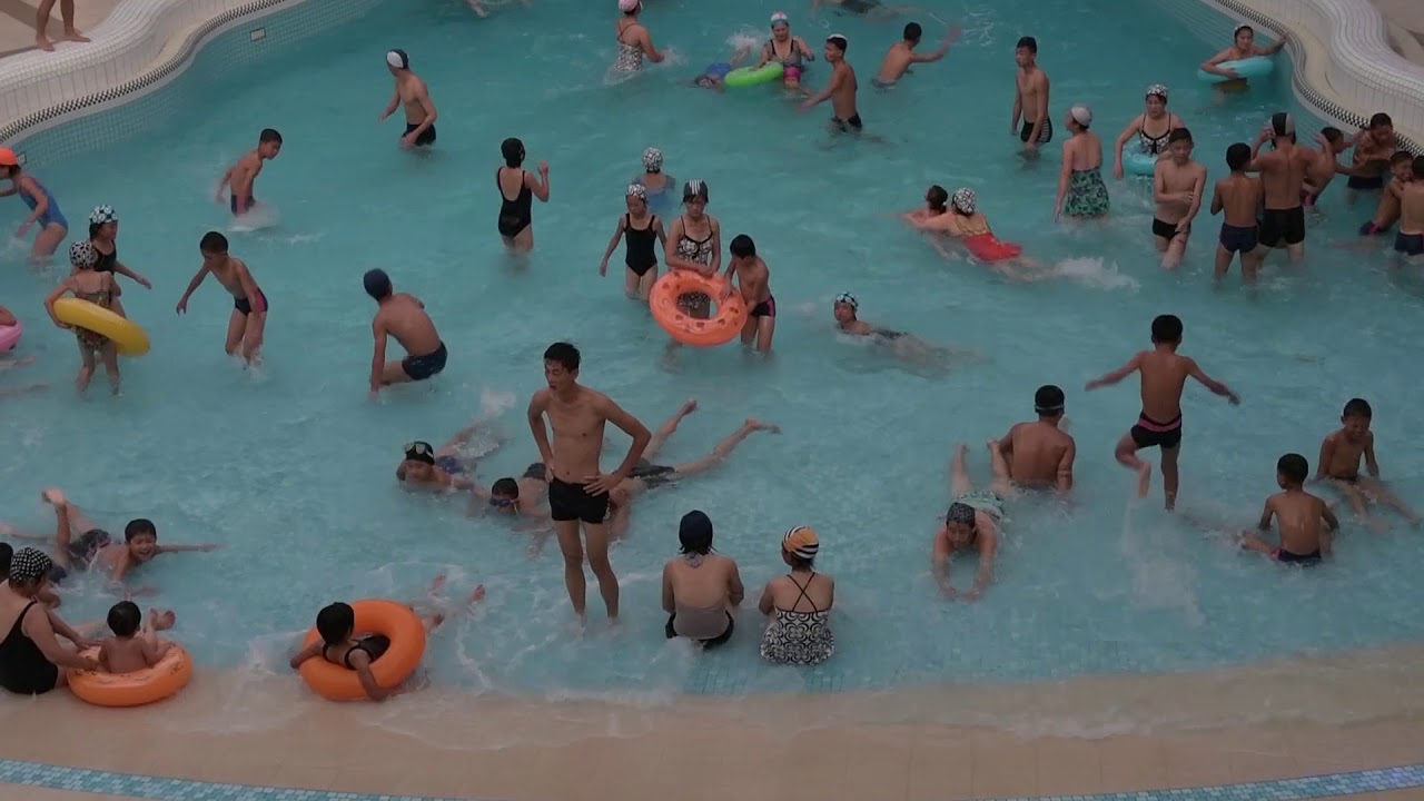 People beat the heat in a swimming complex in North Korea - YouTube