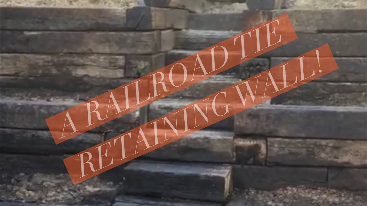 Mountain Movers Installs Railroad Tie Retaining Wall - YouTube