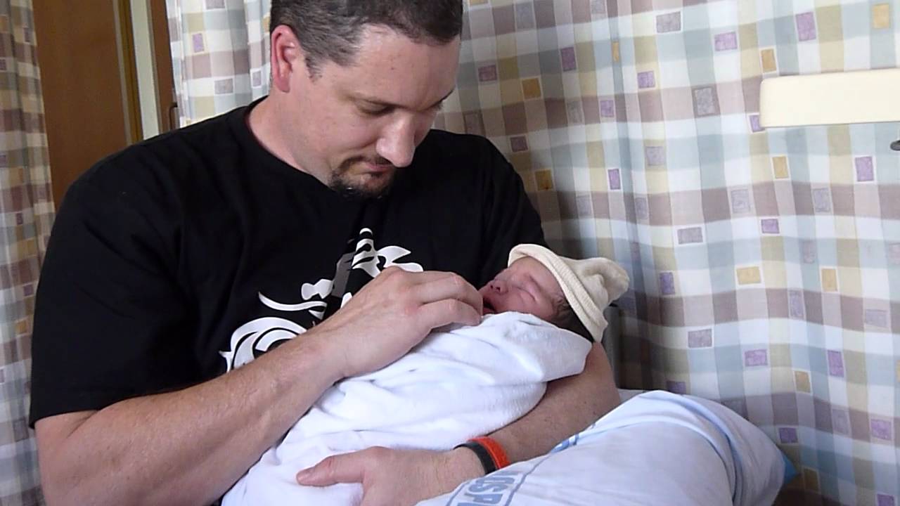 first time daddy cuddle his new born child - YouTube